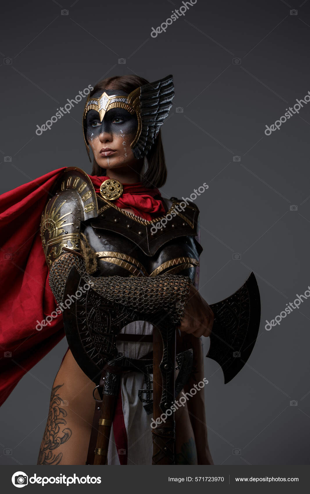 Ancient woman barbarian dressed in red cloak holding axe Stock Photo by ©fxquadro 571723970