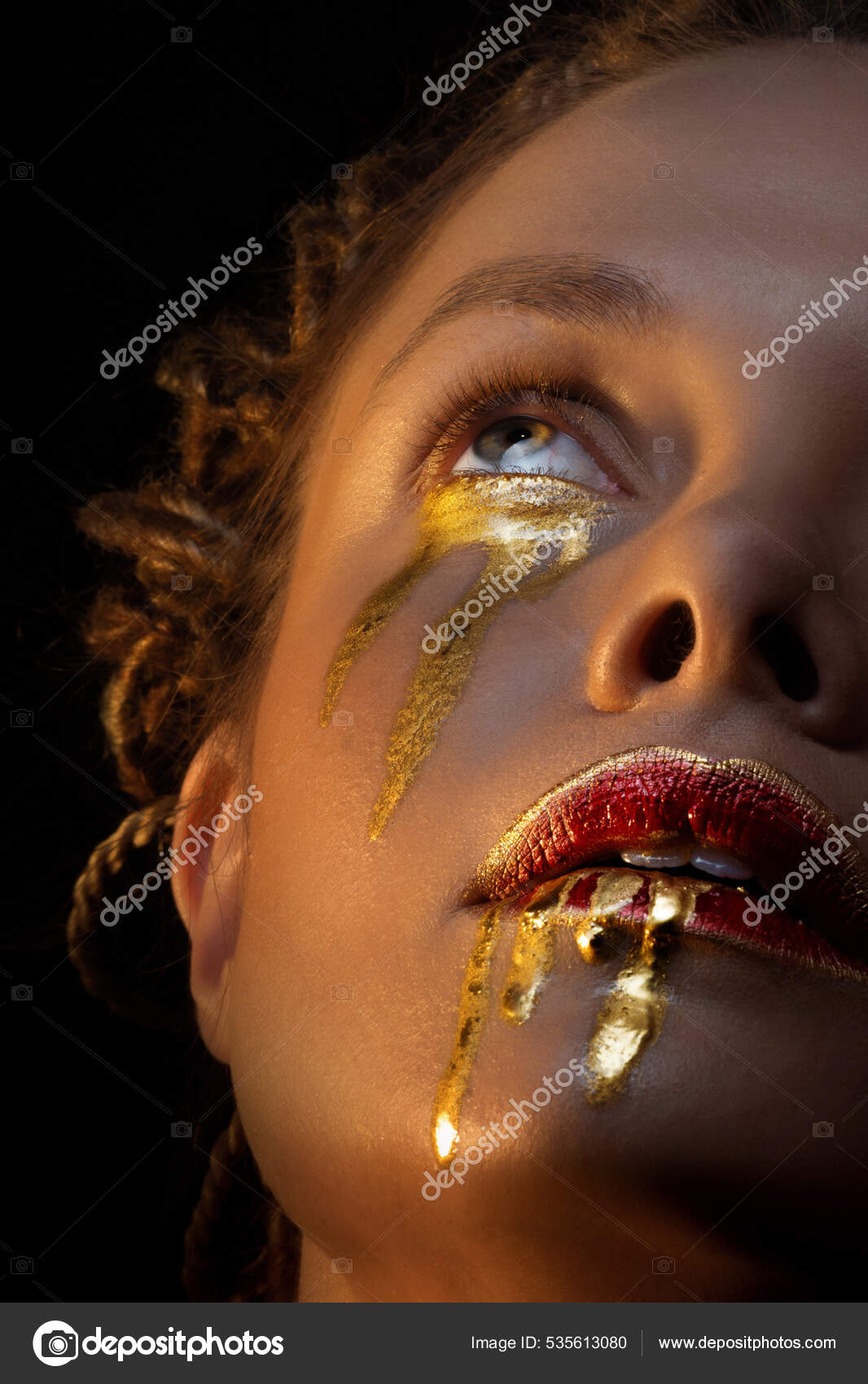 Gold on the skin, face art and creative makeup, gold as tears and blood ...