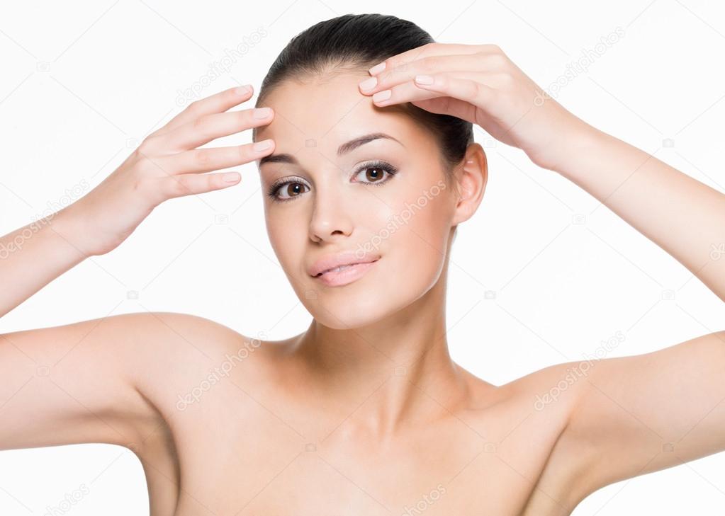 Beautiful woman cares of forehead — Stock Photo © valuavitaly #14283611