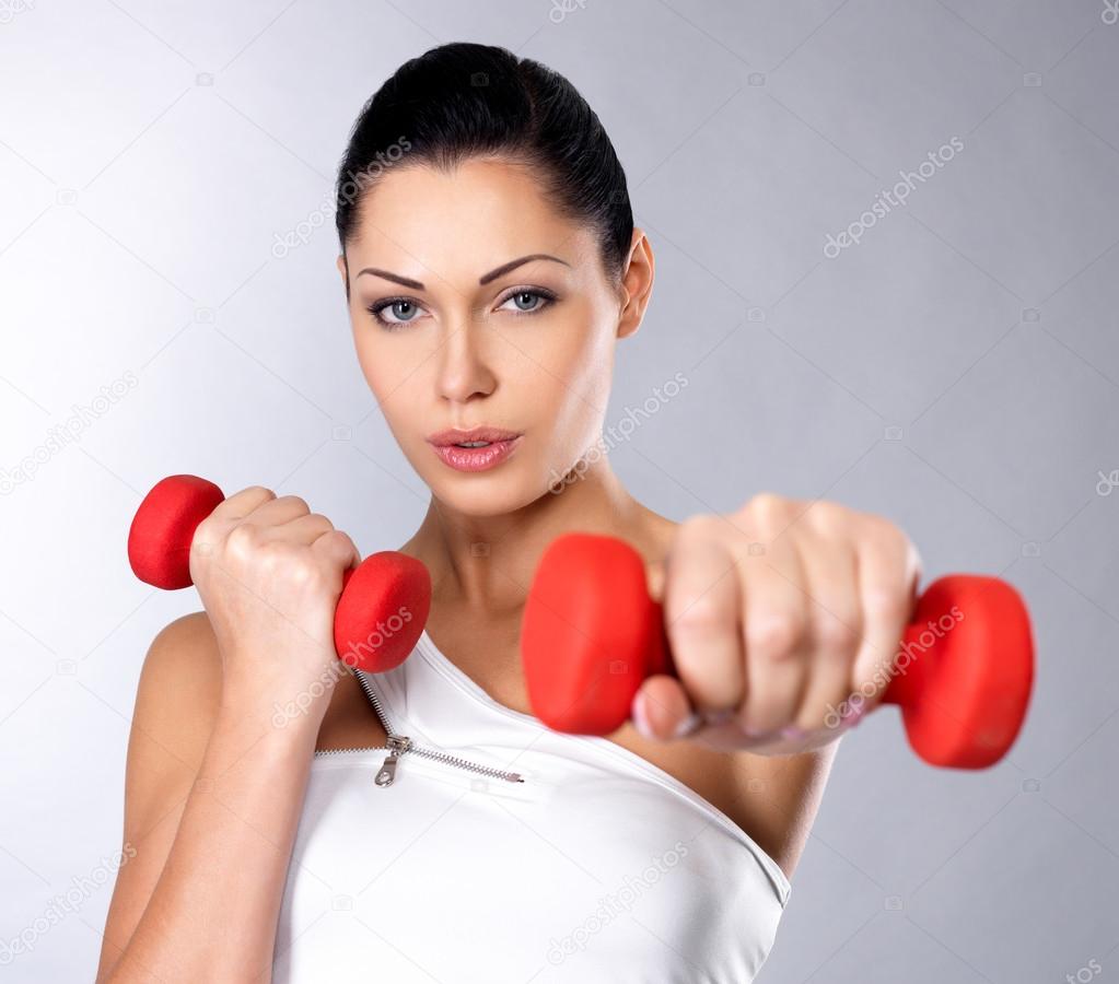 Beautiful young woman with dumbbells — Stock Photo © valuavitaly #14822917