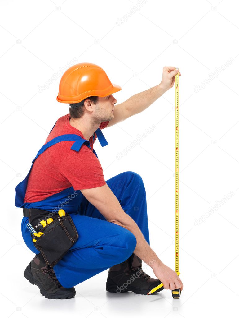 Construction worker measuring the wall Stock Photo by ©valuavitaly 22510161