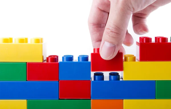 Hand building up a block - Stock Image - Everypixel