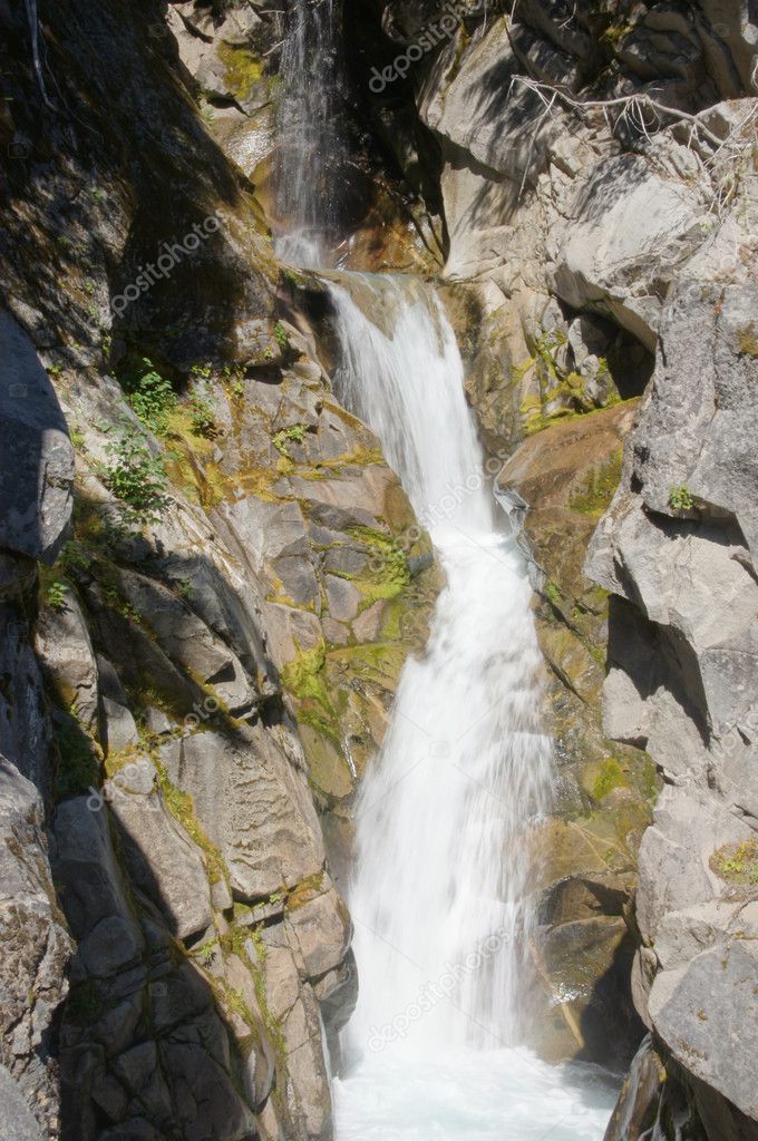 Christine falls surges through a narrow canyon — Stock Photo © cascoly ...