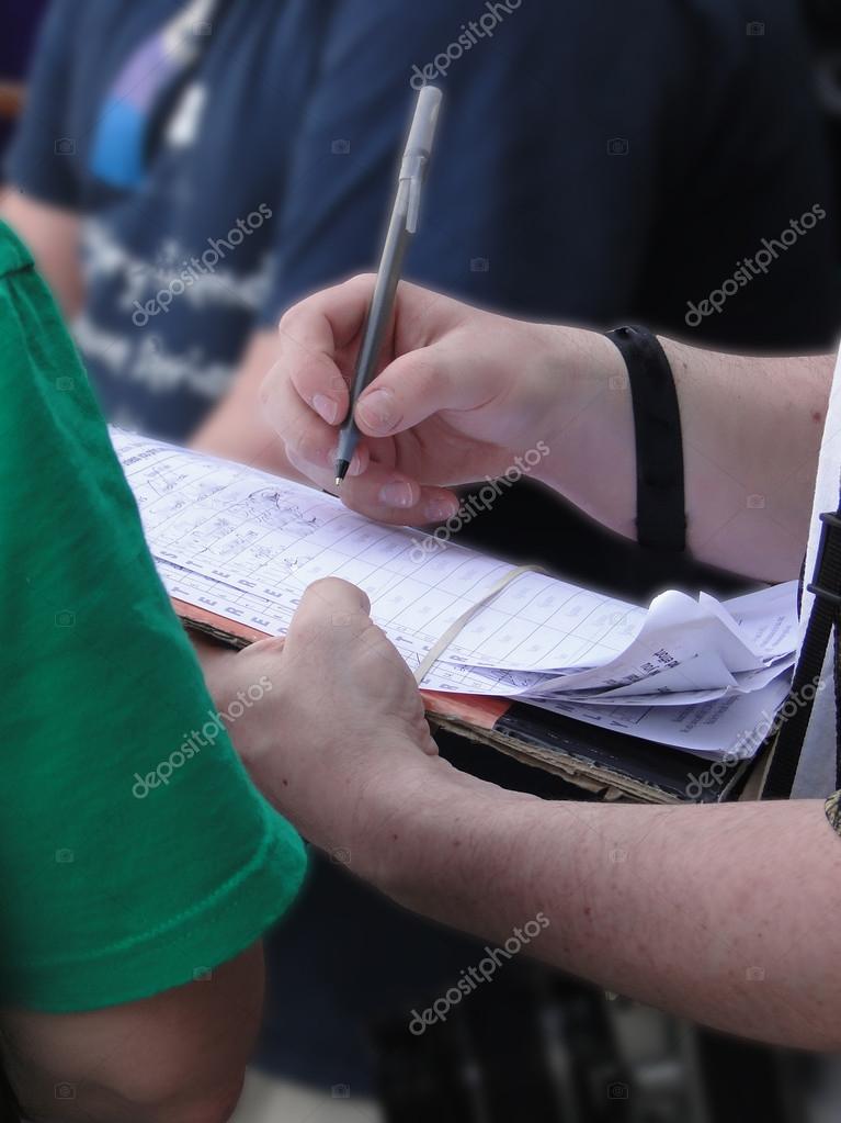 Man signing a petition Stock Photo by ©cascoly 13510282