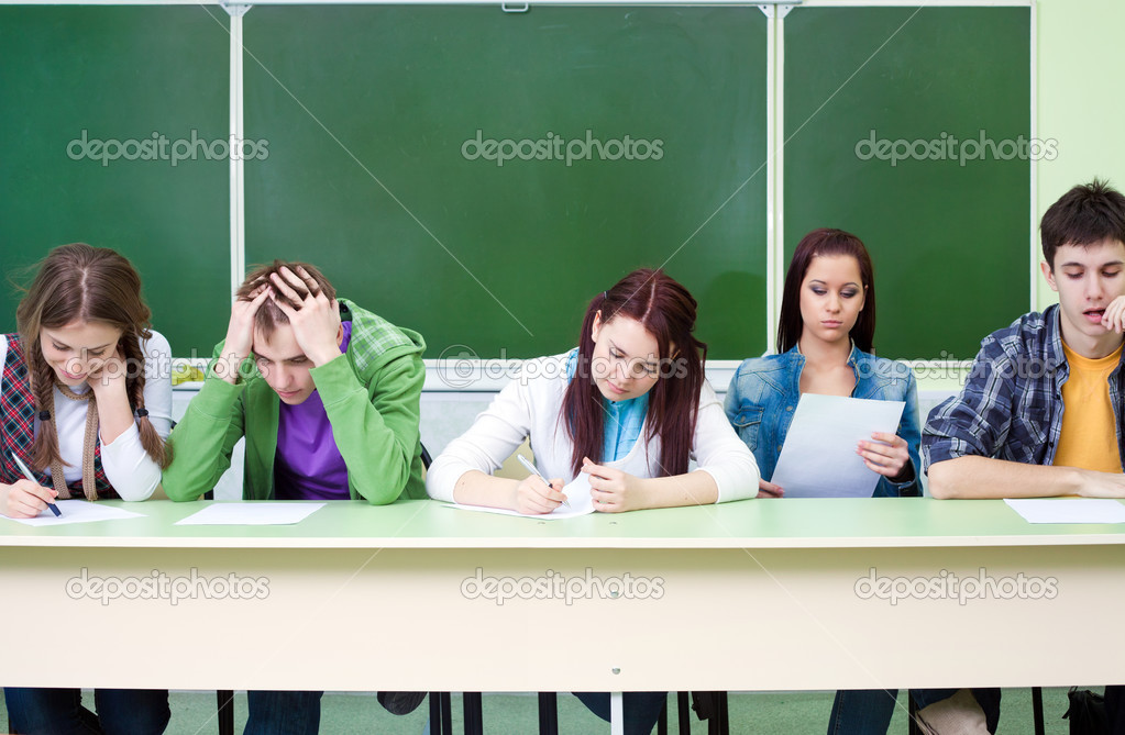 Students on exam in class Stock Photo by ©yanlev 13303889