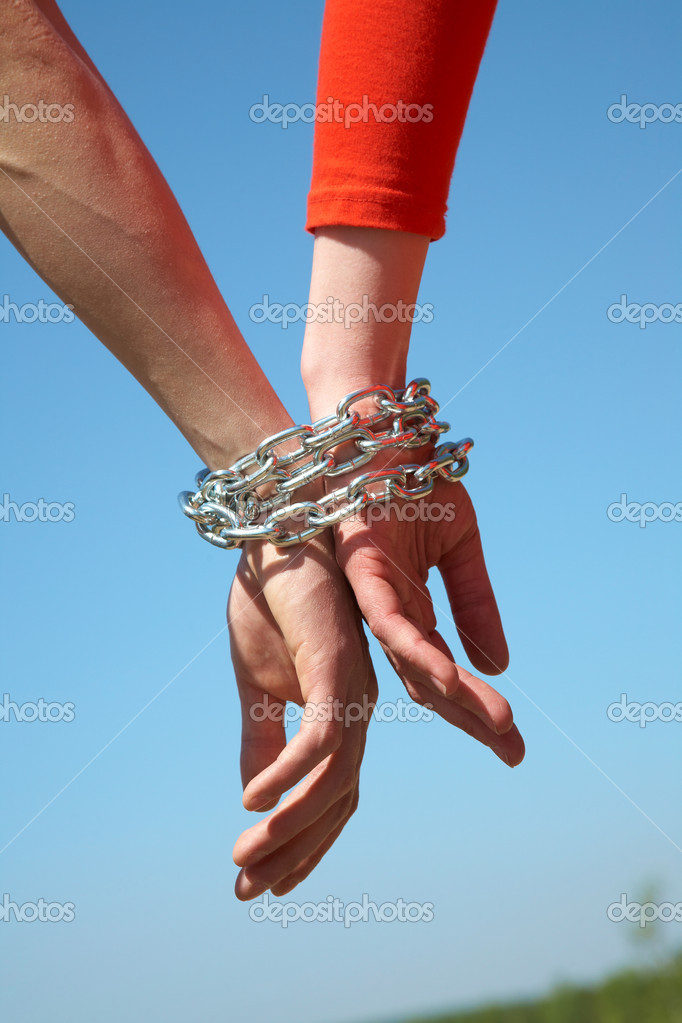 Hands with chain Stock Photo by ©yanlev 46939935