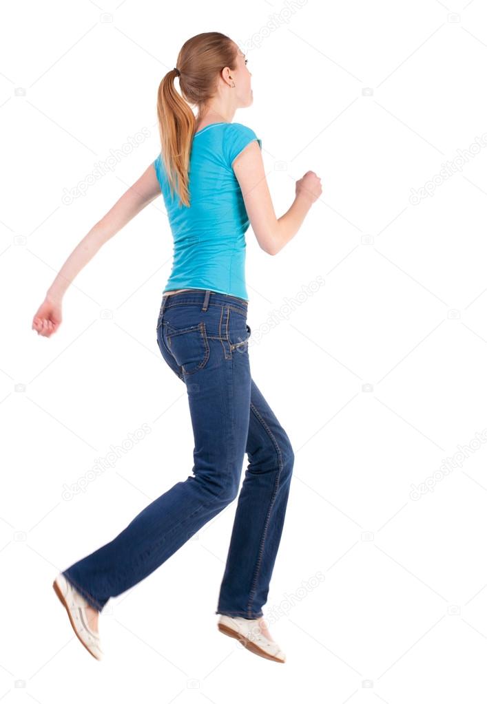 Back view of jumping woman in jeans Stock Photo by ©ghoststone 22741109