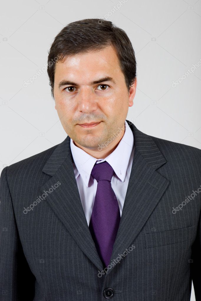 Young business man portrait on a grey background — Stock Photo © zittto ...