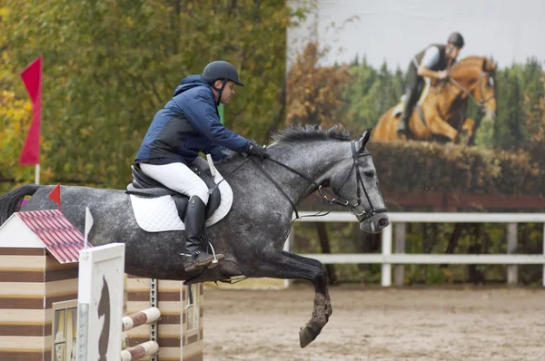 Man show jumping on black horse – Stock Editorial Photo © virgonira ...