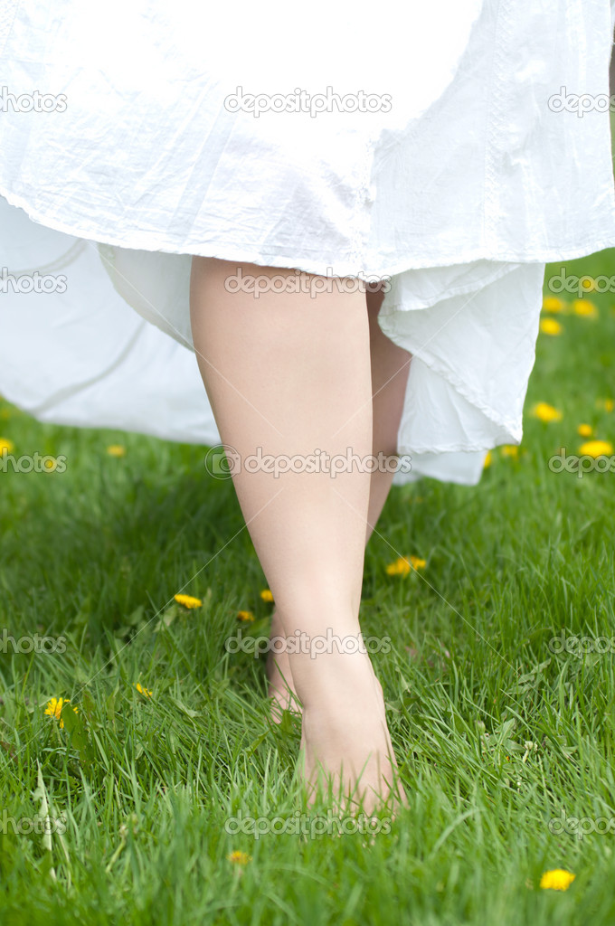 Women bare feet going on the spring grass — Stock Photo © fomicheva ...