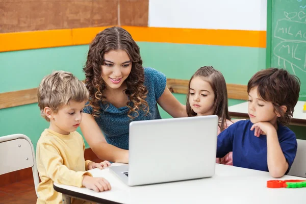 Teacher And Students Using Laptop In Class - Stock Image - Everypixel