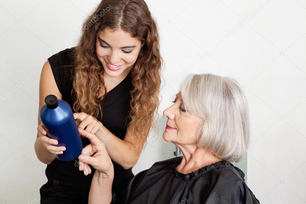Hairdresser Advising Hair Color To Client — Stock Photo © SimpleFoto ...