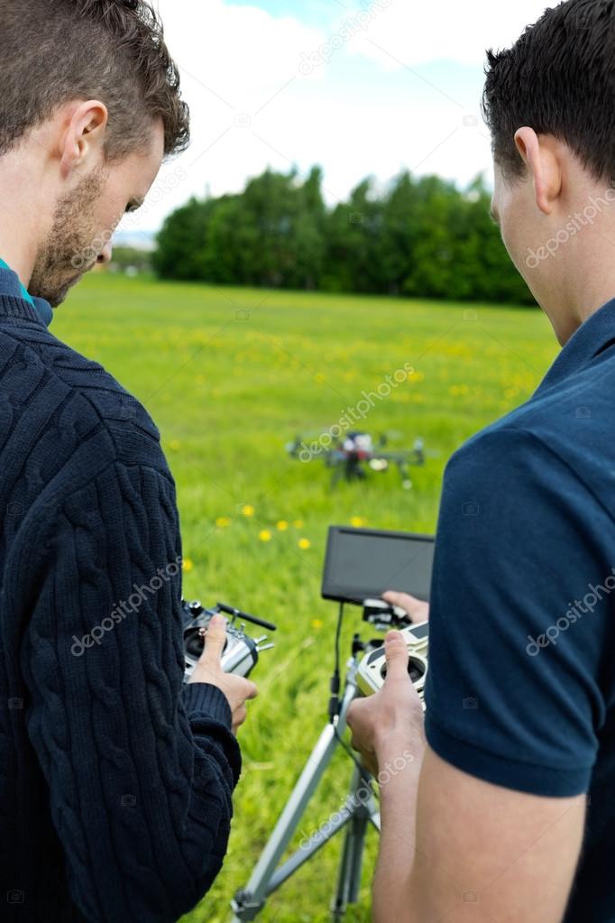 Engineers Operating UAV Helicopter Stock Photo by ©SimpleFoto 31869507