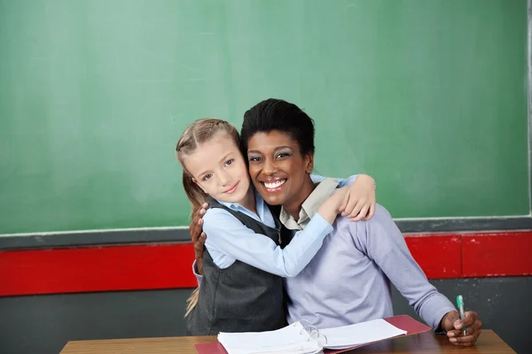 Teacher hugging student Stock Photos, Royalty Free Teacher hugging ...