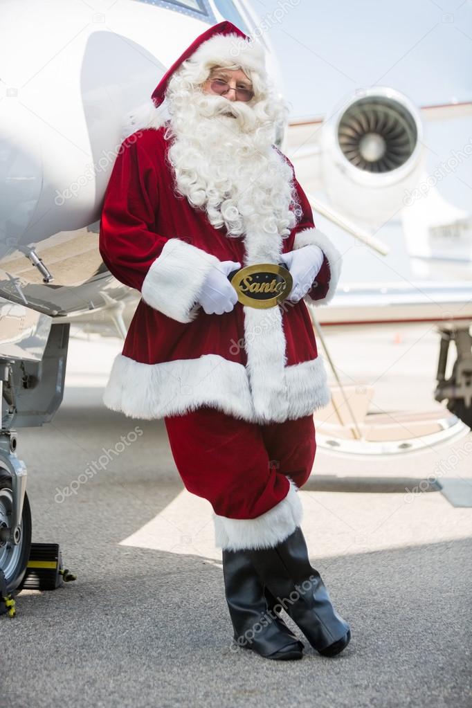 Santa Leaning On Private Jet At Airport Terminal — Stock Photo ...