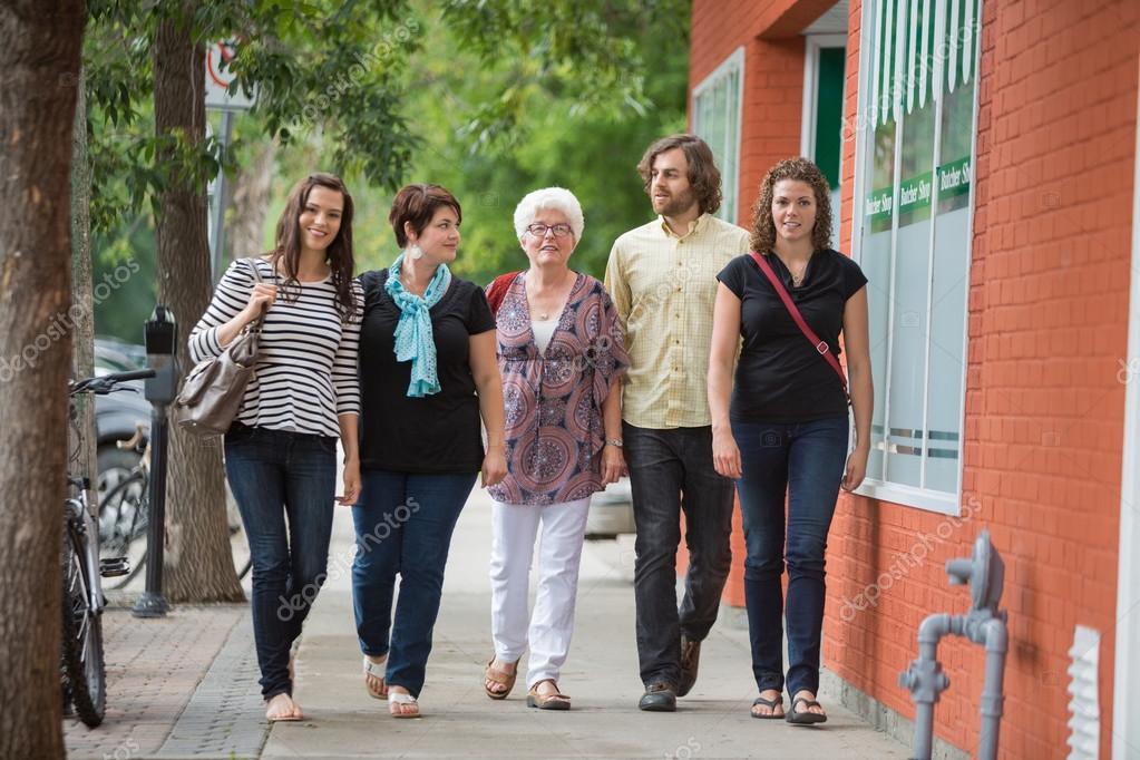 Friends Walking Together On Pavement Stock Photo by ©SimpleFoto 35288433