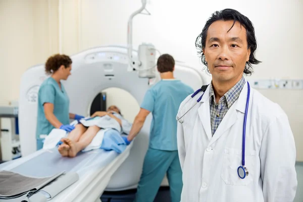 Radiologist With Nurses Preparing Patient For CT Scan Test - Stock ...