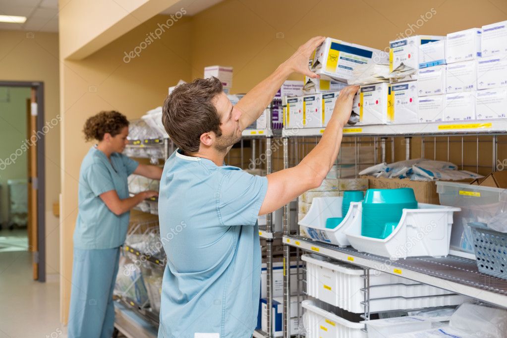 Nurses Arranging Stock In Storage Room Stock Photo by ©SimpleFoto 37453177