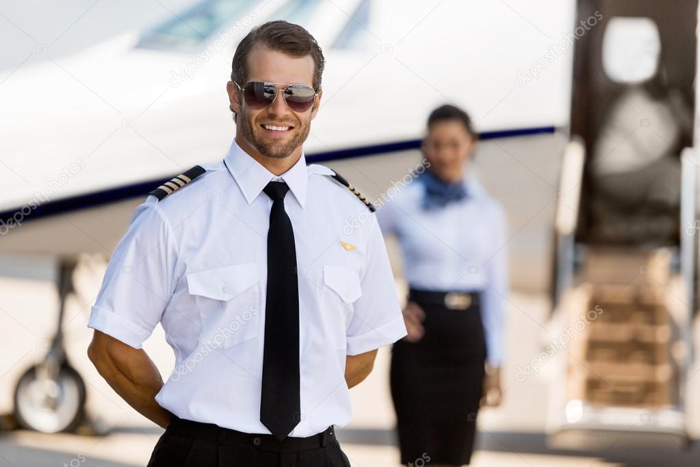 Pilot Standing With Stewardess And Private Jet At Terminal — Stock ...