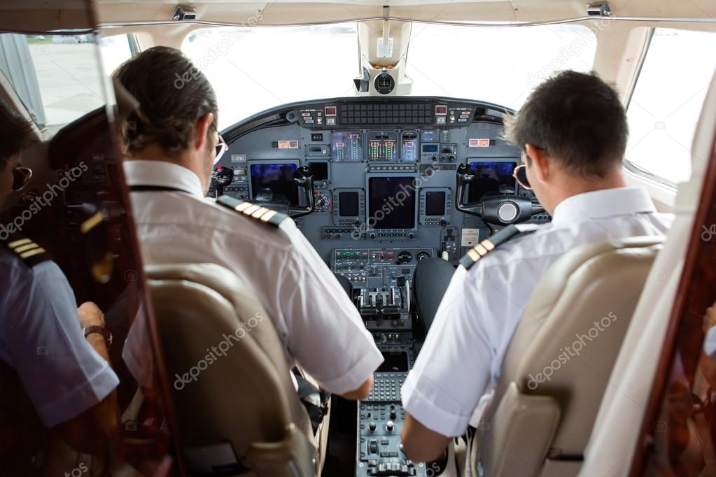 Pilot And Copilot In Cockpit — Stock Photo © SimpleFoto #41537791