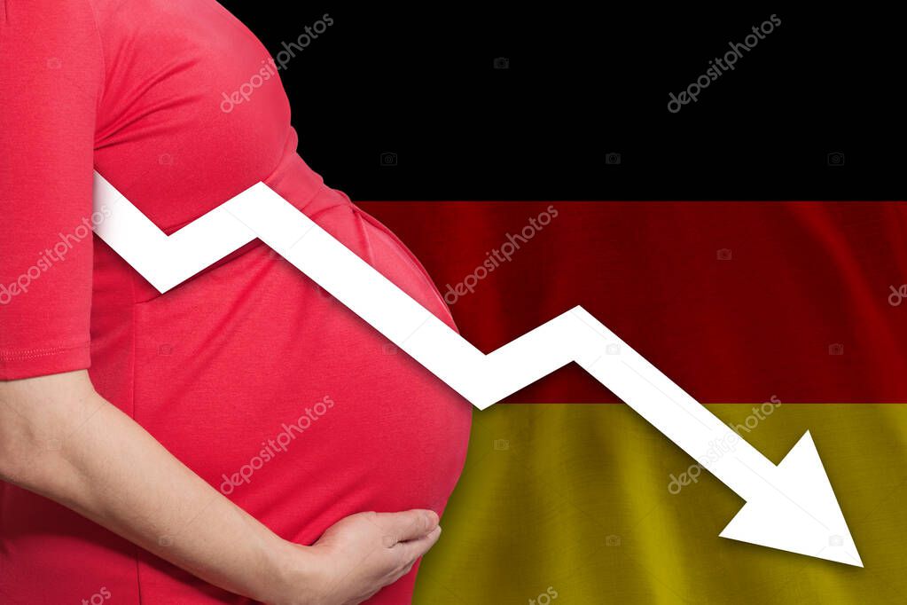 German pregnant woman on German flag background. Falling fertility rate ...