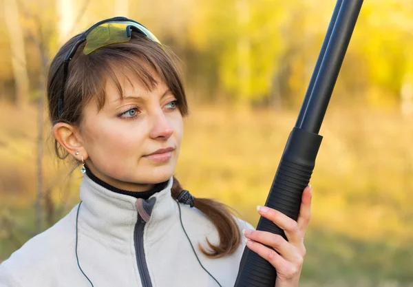 Young beautiful girl with a shotgun Stock Photo by ©vlad_star 13754270