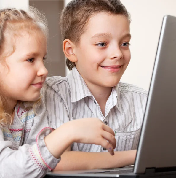 Two happy children playing games Stock Photo by ©.shock 1673411