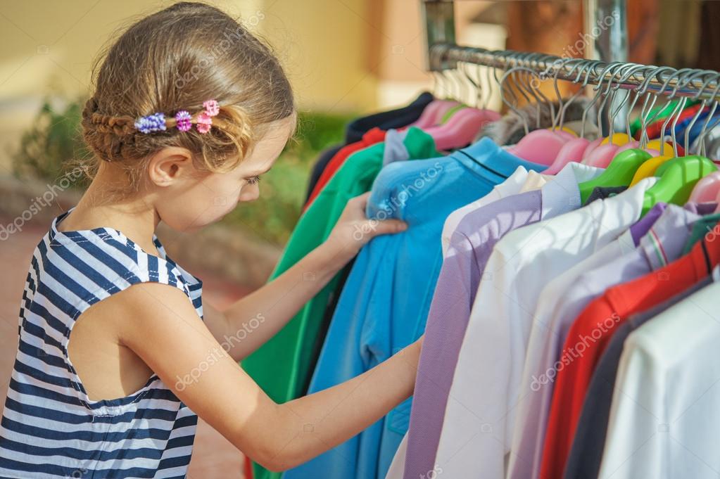 Beautiful girl choose right clothes — Stock Photo © BestPhotoStudio ... Beautiful girl choose right clothes — Stock Photo © BestPhotoStudio ...