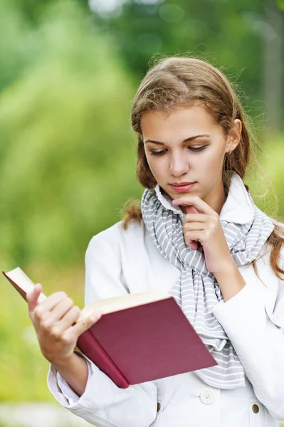 Beautiful woman reading red, book - Stock Image - Everypixel