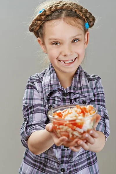 Little girl with salad Stock Photo by ©BestPhotoStudio 52934061