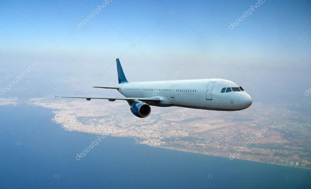 Airplane flying above earth backgroun Stock Photo by ©dimmushka 36459267