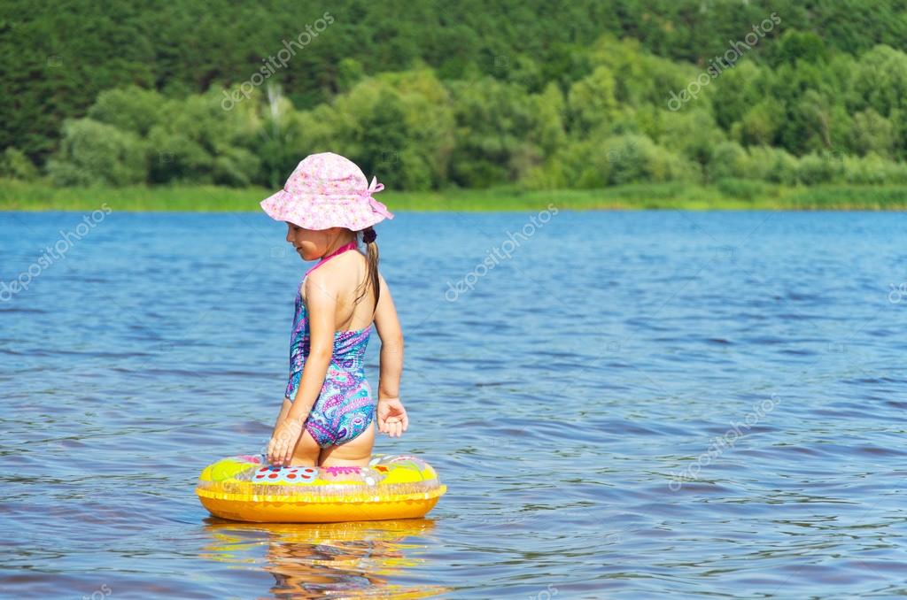 Little girl at river — Stock Photo © rbvrbv #48373501