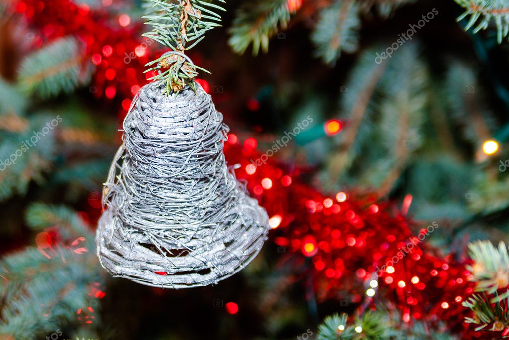 Silver bell on christmas tree Stock Photo by ©tarczas 40169595