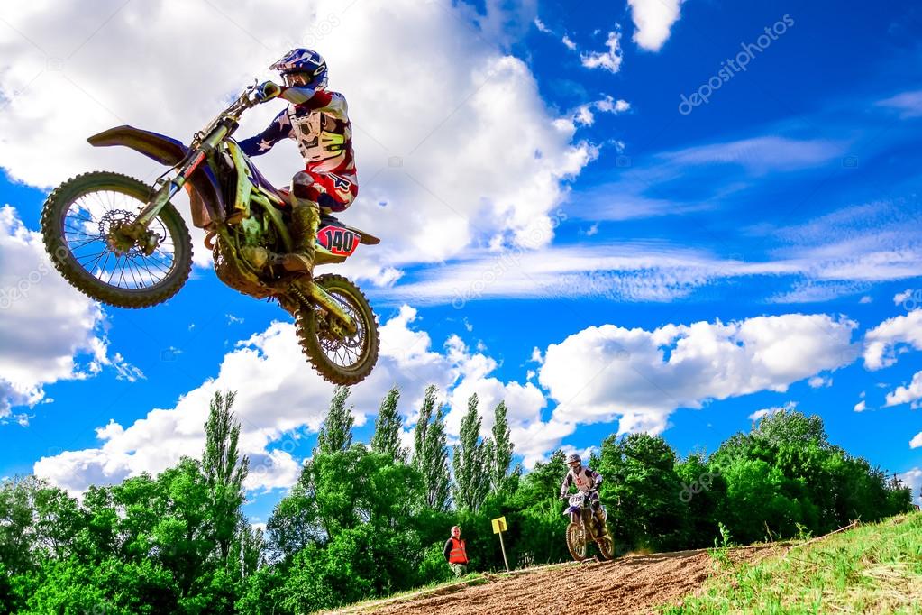 Motocross riders on the race — Stock Editorial Photo © tarczas #49764981