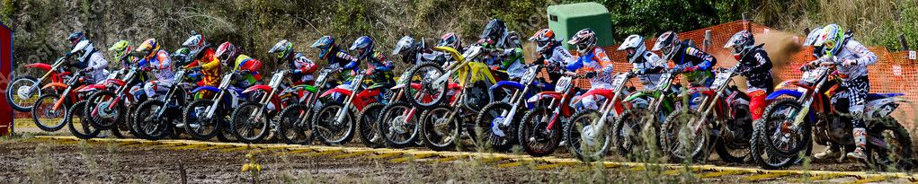 Motocross riders at start line — Stock Editorial Photo © tarczas #51196993