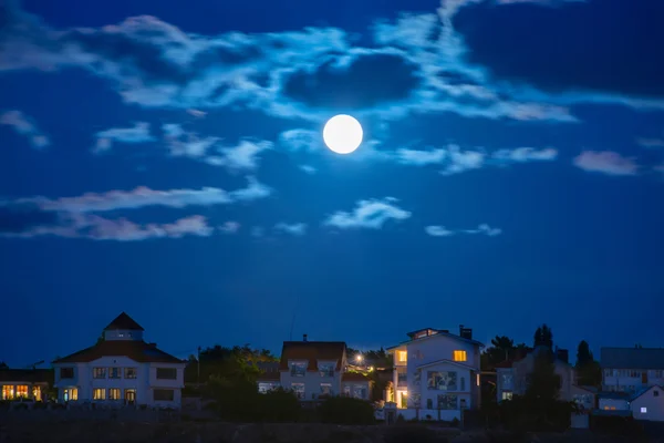 Moon over town Stock Photos, Royalty Free Moon over town Images ...