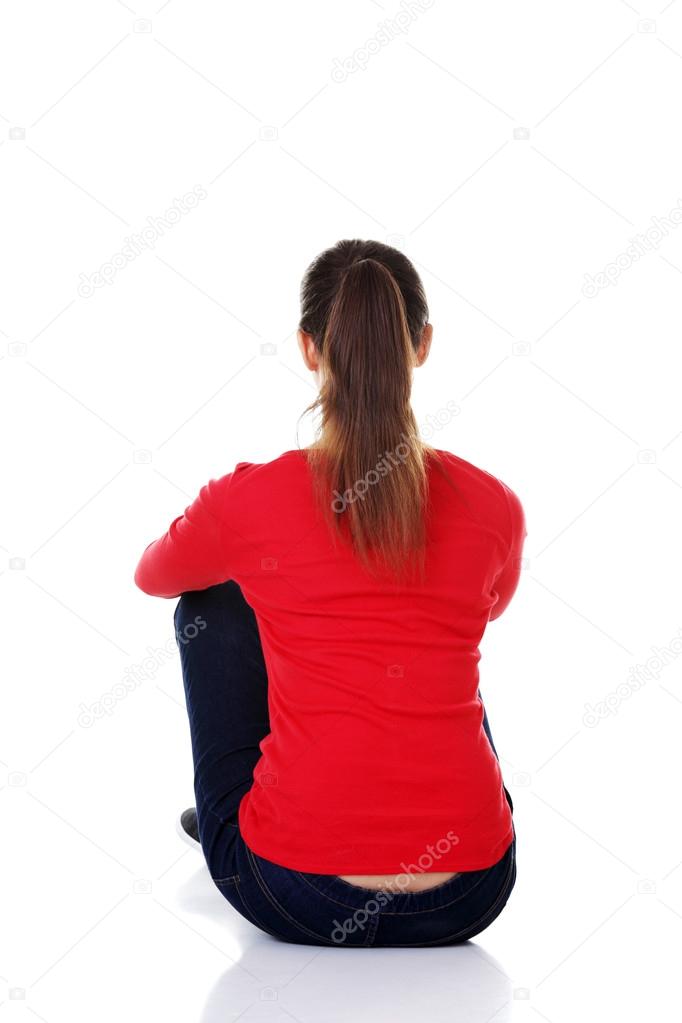 Back view of beautiful young woman sitting on the floor — Stock Photo ...