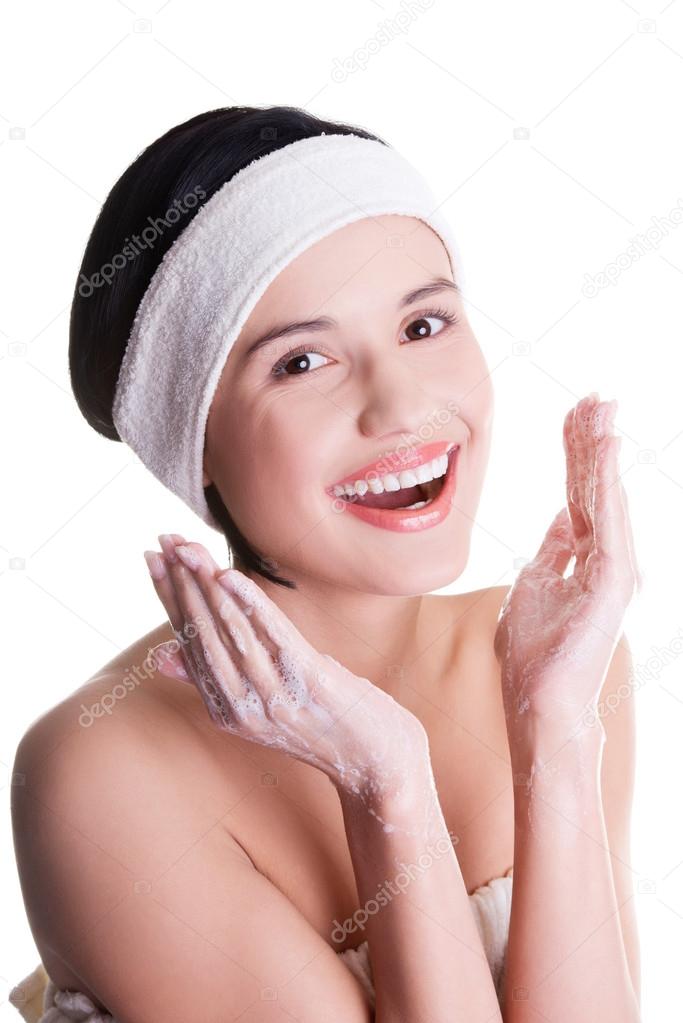 Beautiful woman is cleaning her face — Stock Photo © piotr_marcinski ...