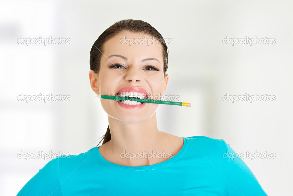 Thoughtful woman biting pencil Stock Photo by ©piotr_marcinski 42729777
