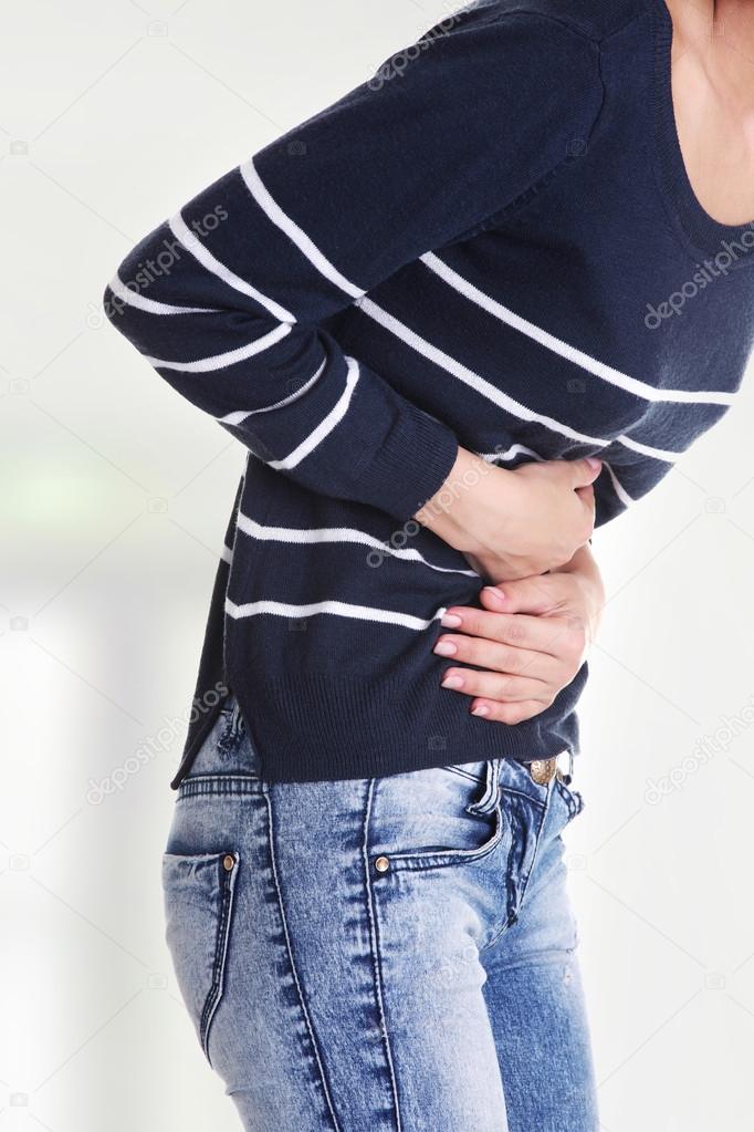 Woman heaving belly ache — Stock Photo © piotr_marcinski #42735445