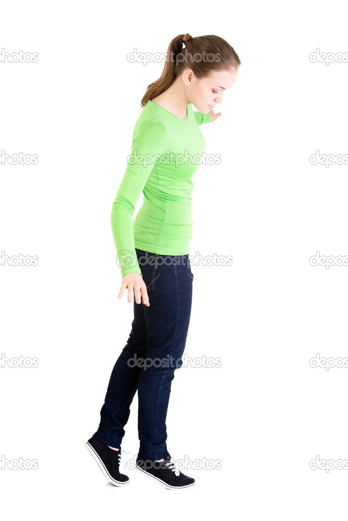 Woman standing and looking down, touching copy space. Stock Photo by ...