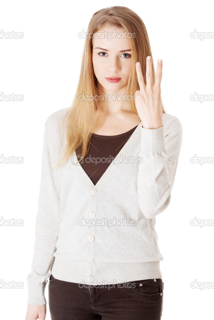 Beautiful casual woman showing three fingers. — Stock Photo © piotr ...
