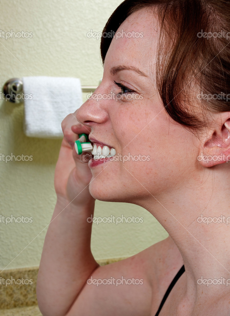 Beautiful Woman Brushing Teeth Stock Photo by ©robeo123 12512456
