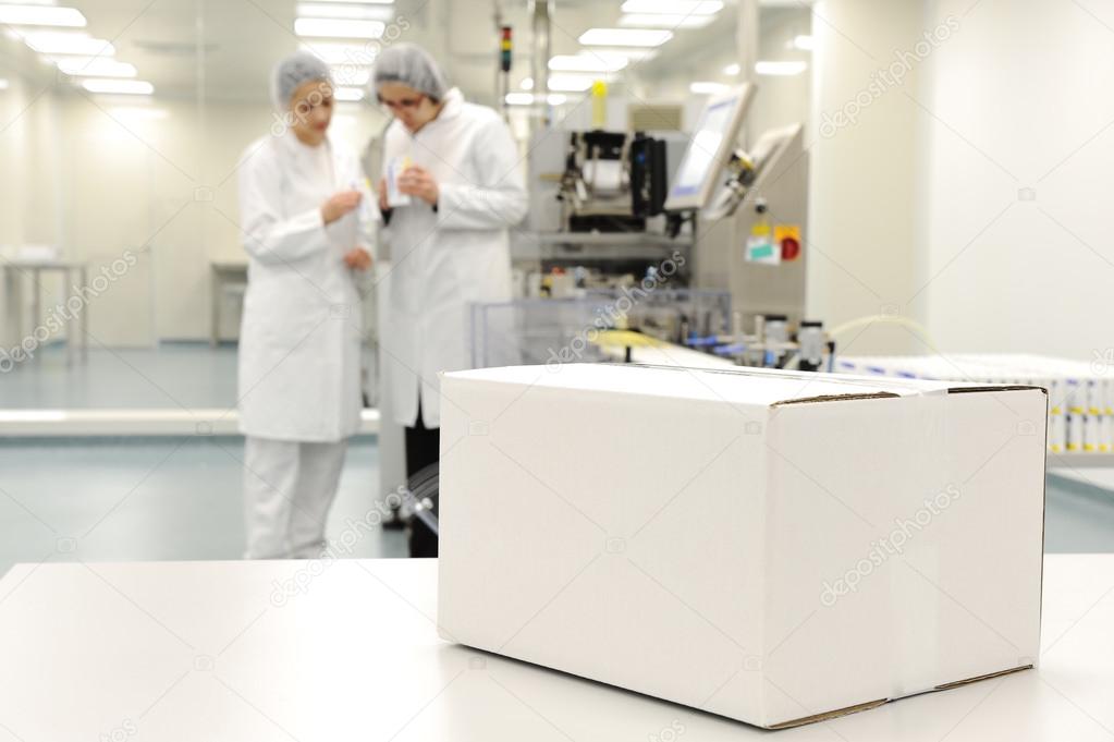 White box at automated production line at modern factory - ready for ...