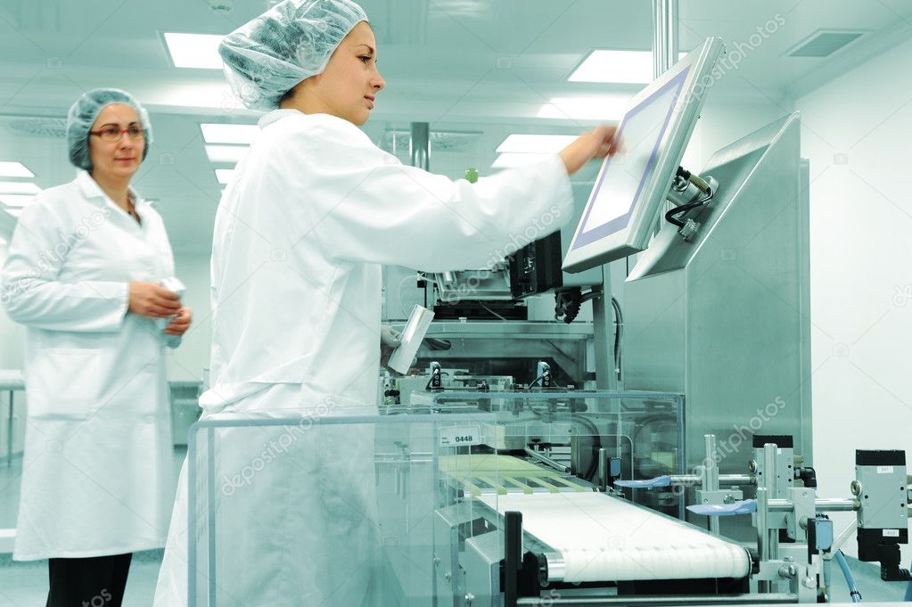 Working at production line in modern factory — Stock Photo © zurijeta ...