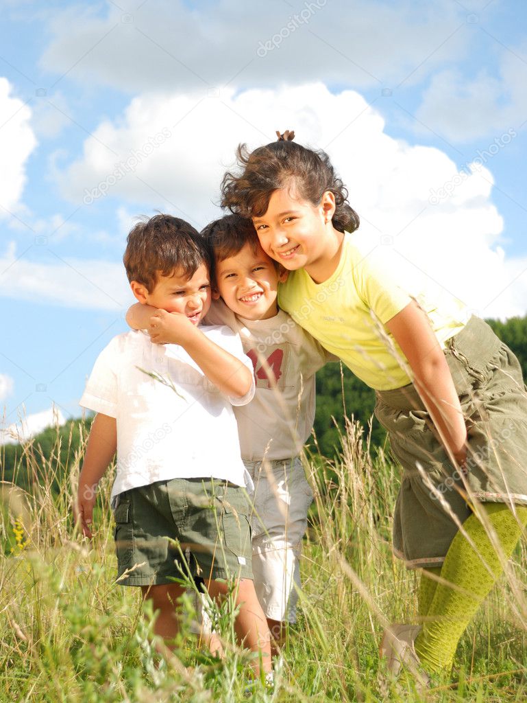 Happy three children in nature — Stock Photo © zurijeta #21443415