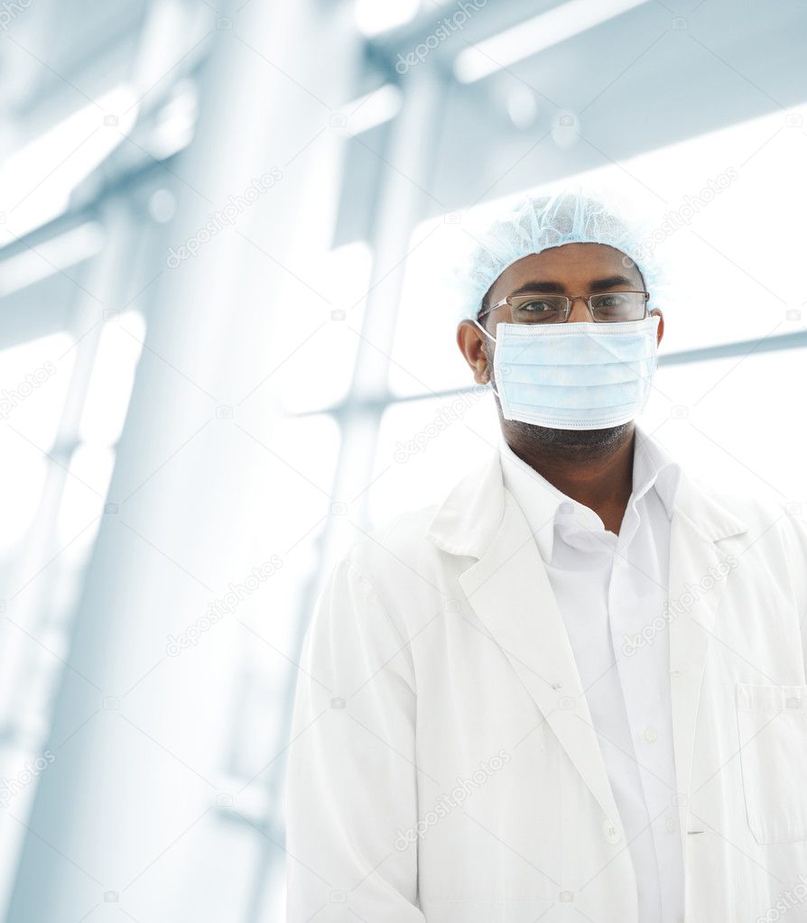 Working with white uniforms in modern facility Stock Photo by ©zurijeta ...