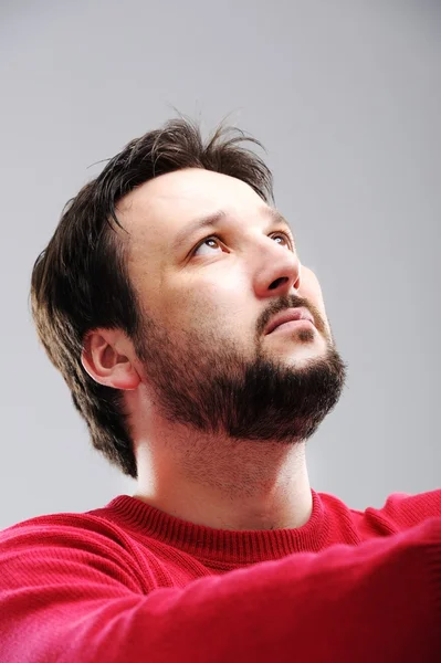 Smiling thoughtful man with a modern hairstyle Stock Photo by ...