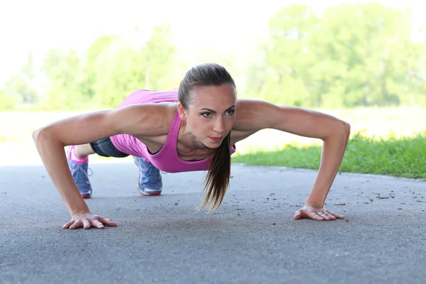 Woman during push-ups - Stock Image - Everypixel