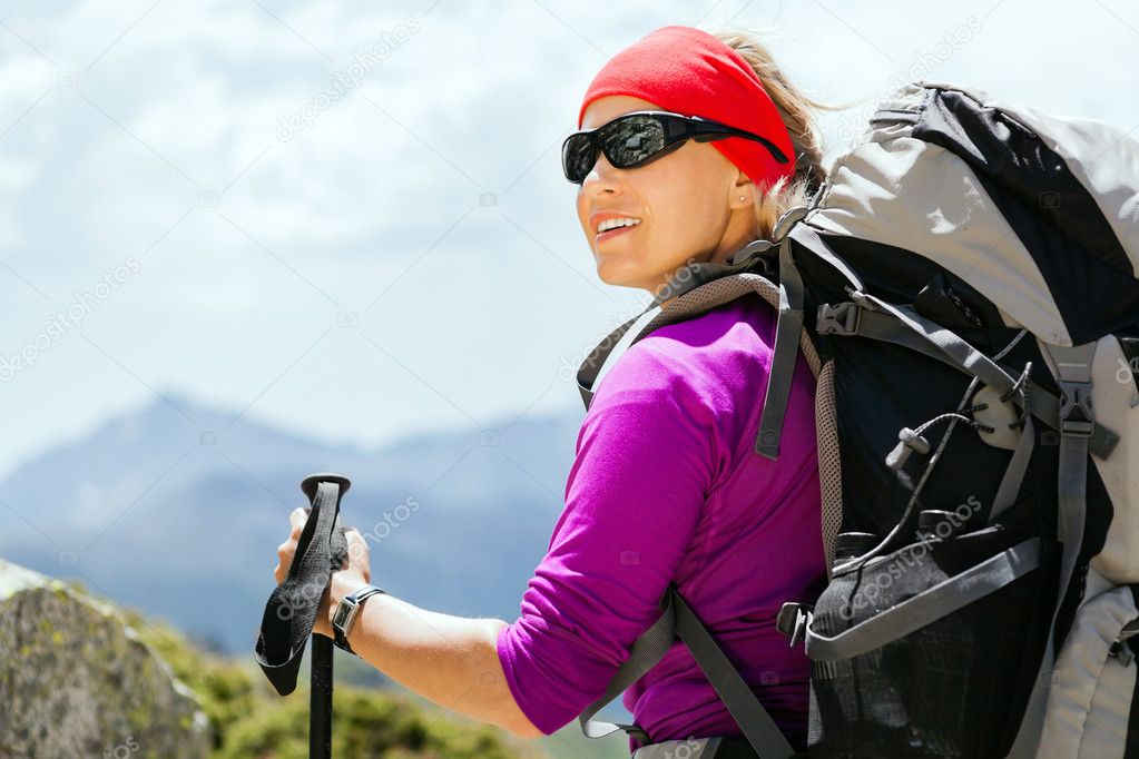 Woman hiking with backpack in mountains — Stock Photo © blasbike #15519745